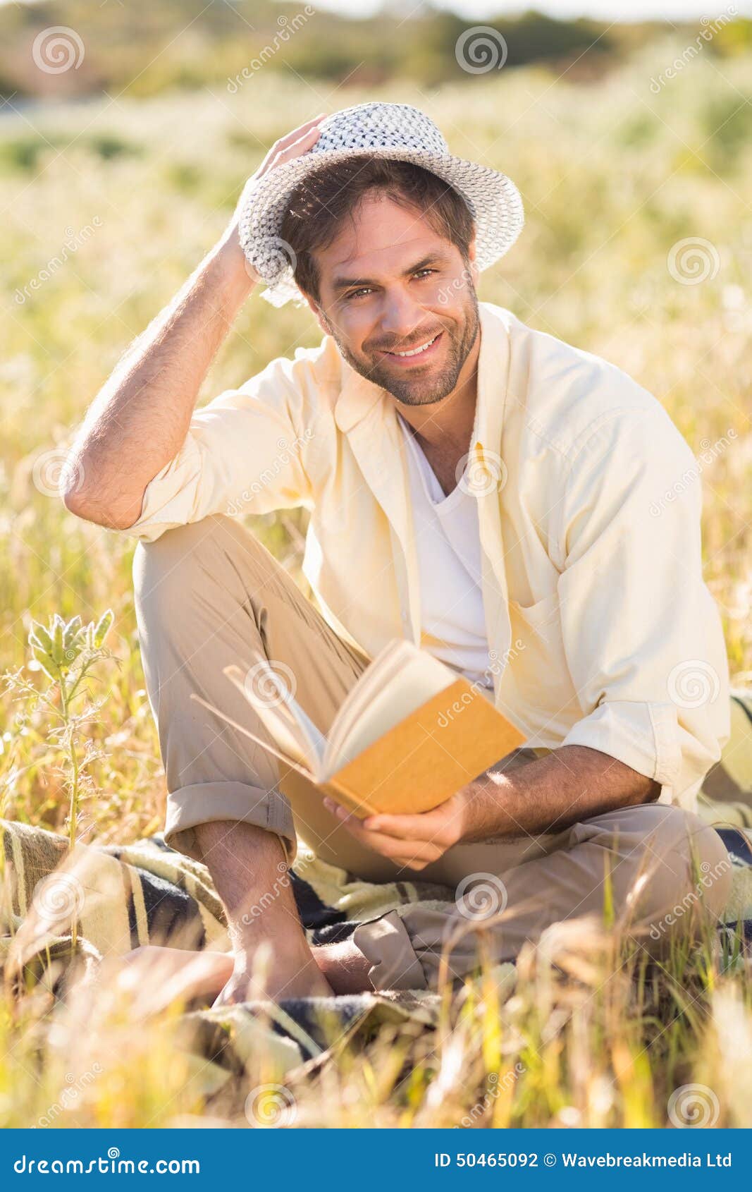 Happy man reading a book stock photo. Image of leisure - 50465092