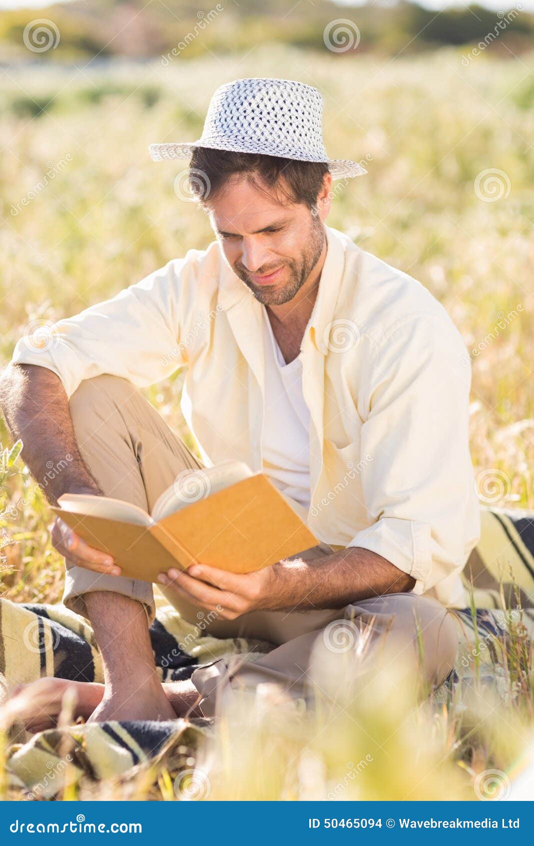 Happy man reading a book stock photo. Image of literature - 50465094