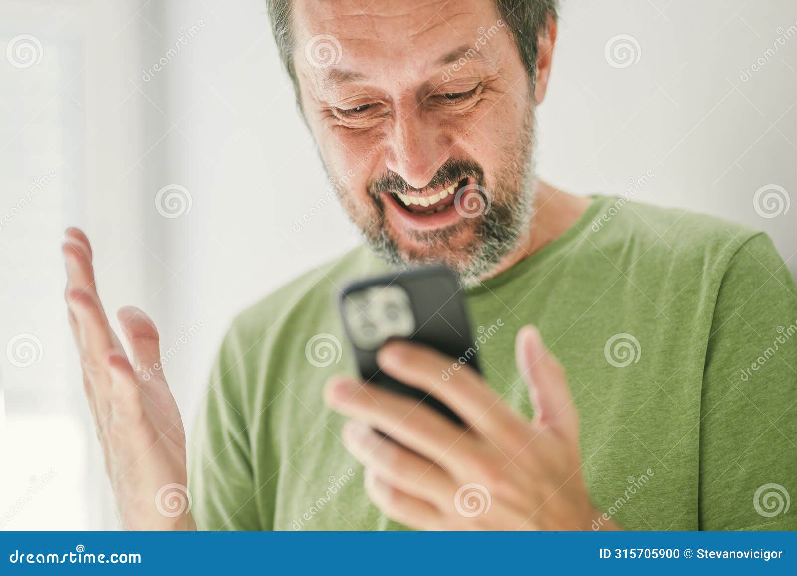 Happy Man Received Satisfying Text Message on Mobile Smartphone Stock ...