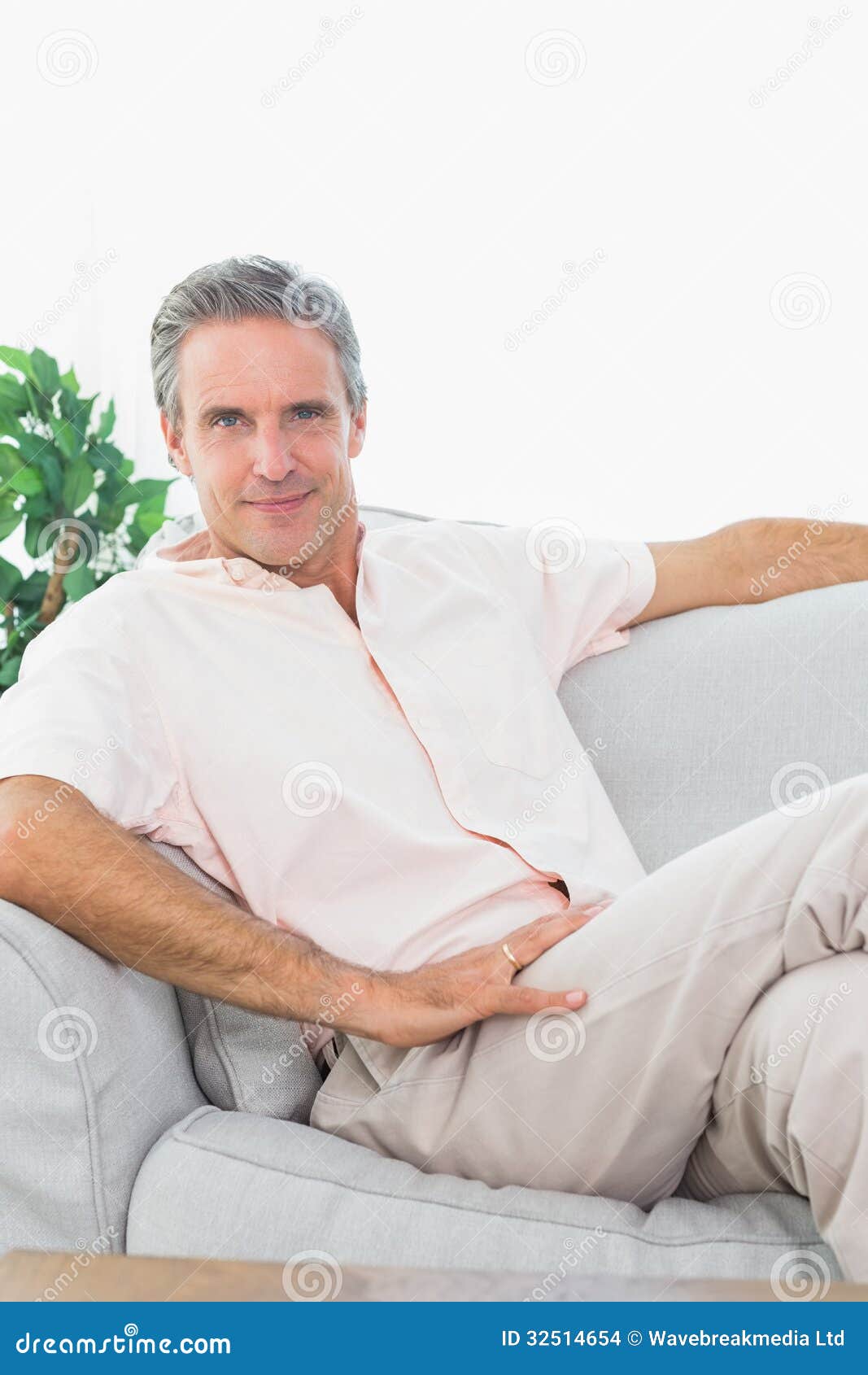 Happy Man Relaxing on His Couch Stock Photo - Image of casual, cheerful ...