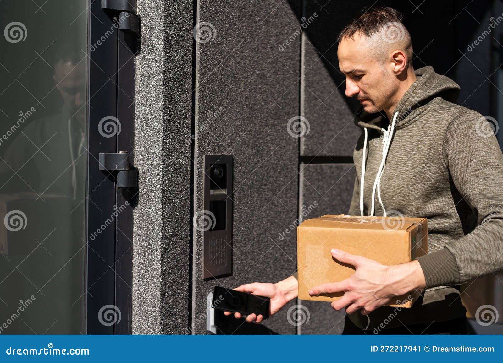 Happy Man Ringing Intercom with Camera in Entryway. Stock Image - Image ...