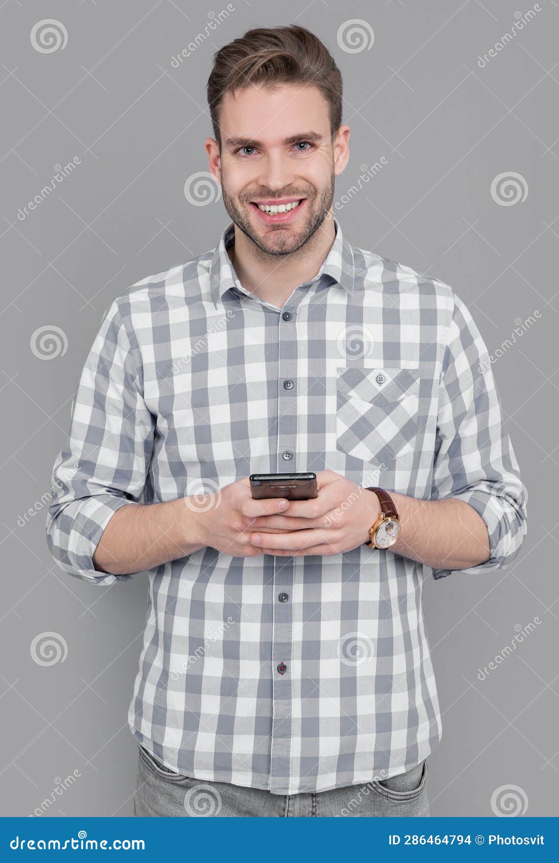 Happy Man Sending Sms Message from Mobile Phone Studio Isolated on Grey ...