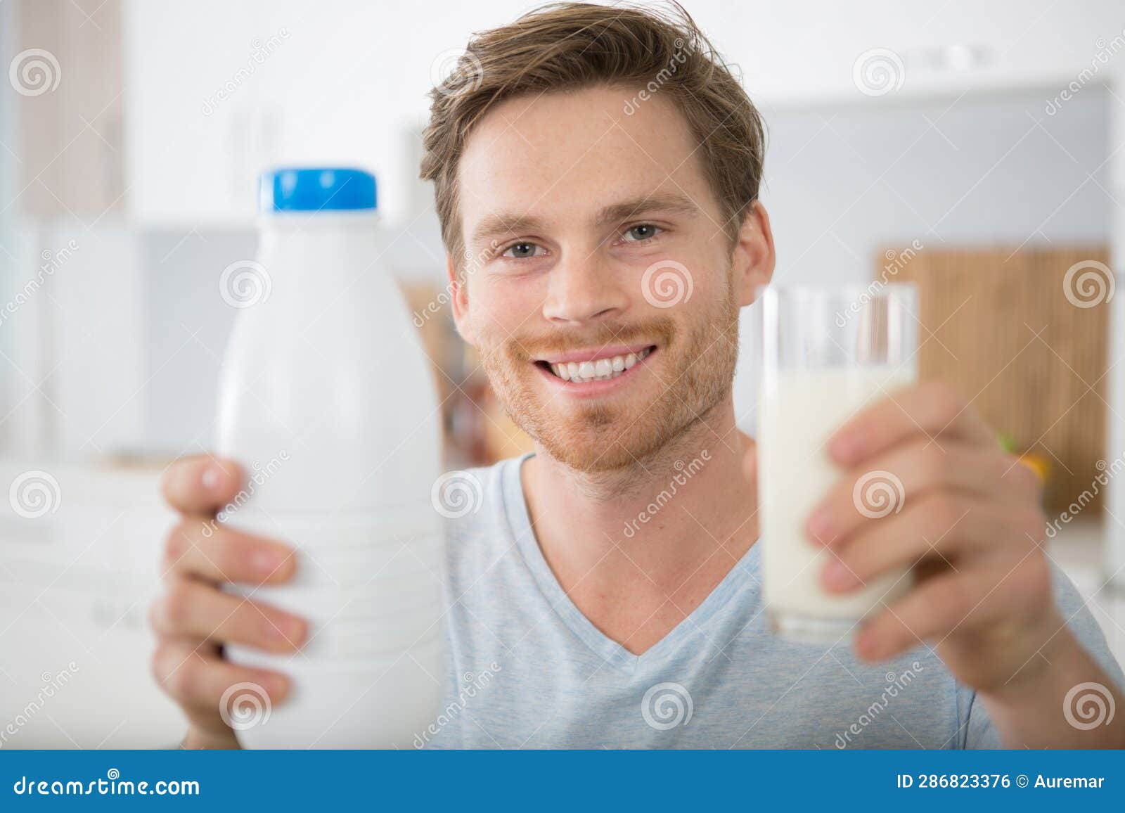 Happy Man Showing Milk at Camera Stock Photo - Image of glass ...