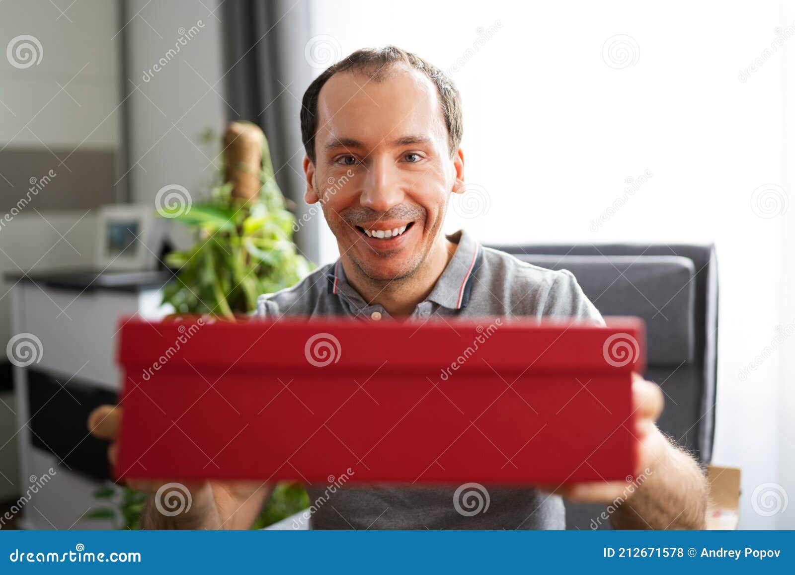 Happy Man Sitting stock photo. Image of home, looking - 212671578