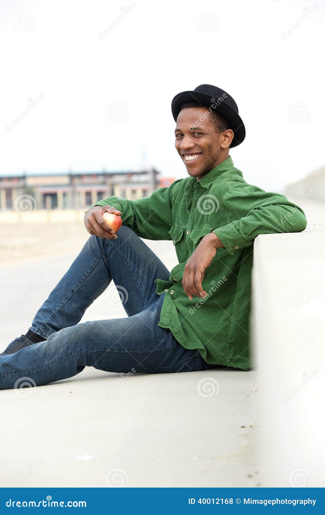Happy Man Sitting Outdoors with Apple Stock Photo - Image of lifestyle ...