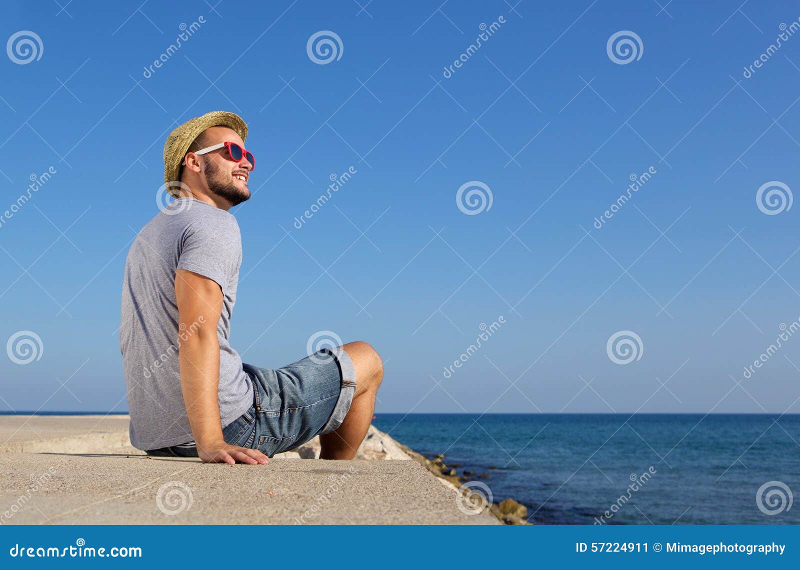 Happy Man Sitting by the Sea with Hat Stock Image - Image of recreation ...
