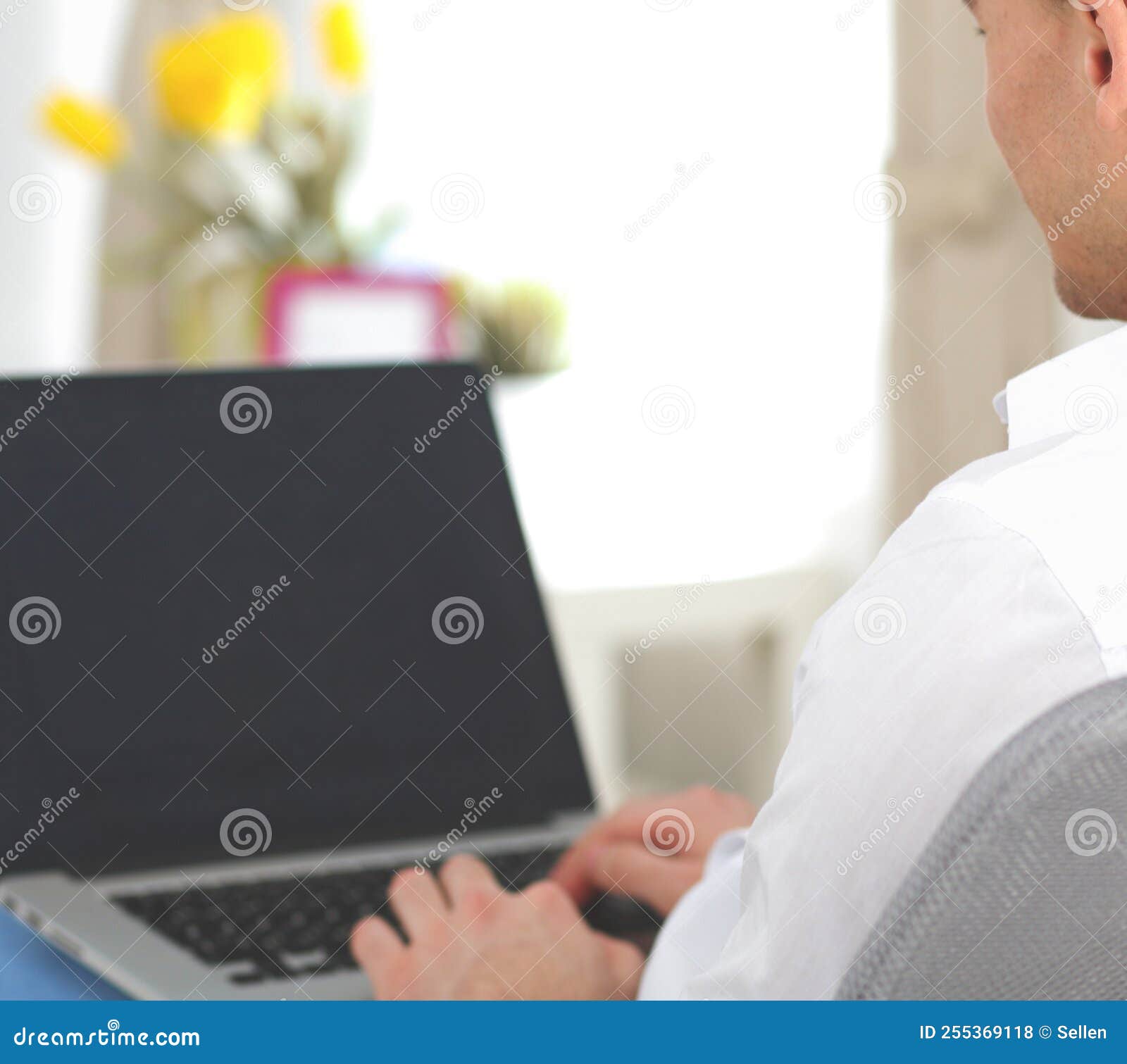 Happy Man Sitting on Table and Using Laptop at Home Stock Photo - Image ...