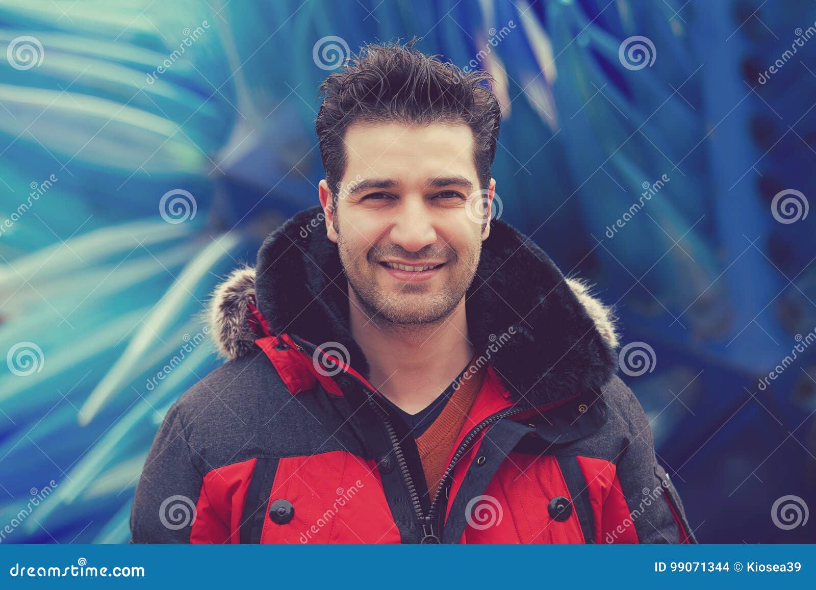 Happy Man Standing Outdoors on a Background of Blue Glass Stock Photo ...
