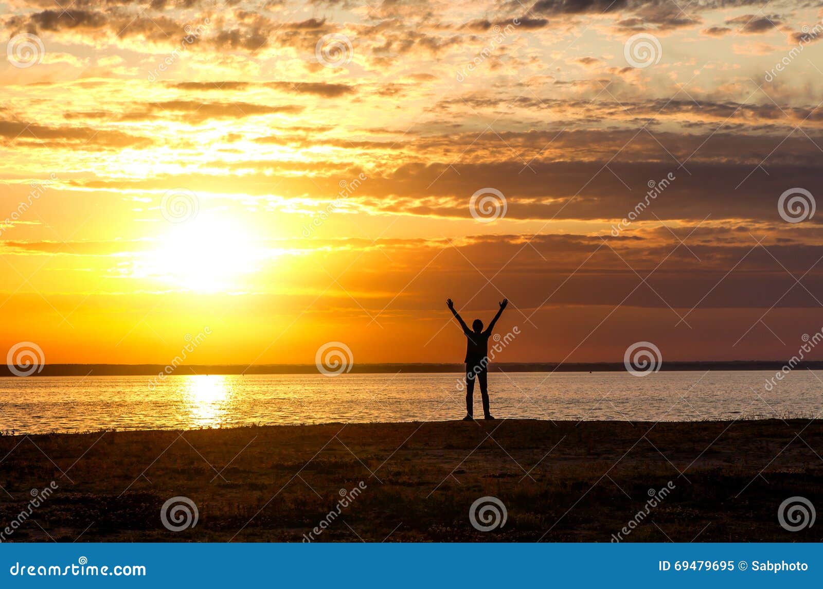 Happy Man at Sunset stock image. Image of rear, arms - 69479695
