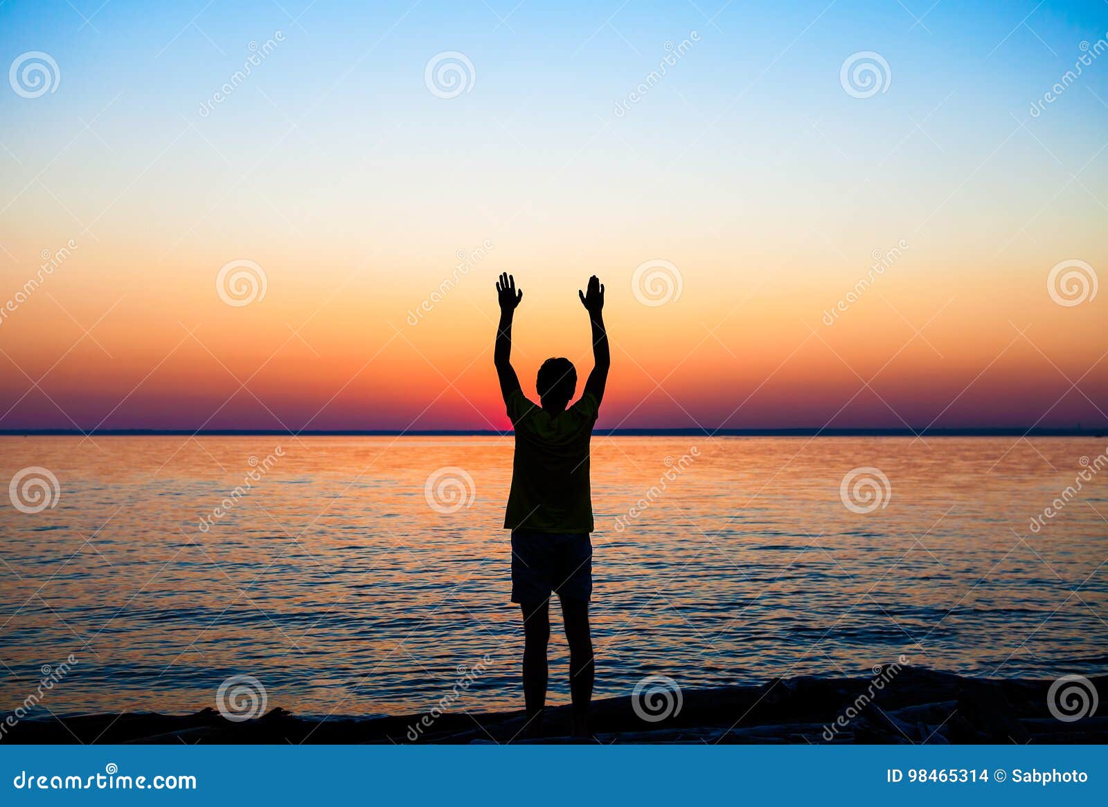 Happy Man at Sunset stock photo. Image of arms, back - 98465314