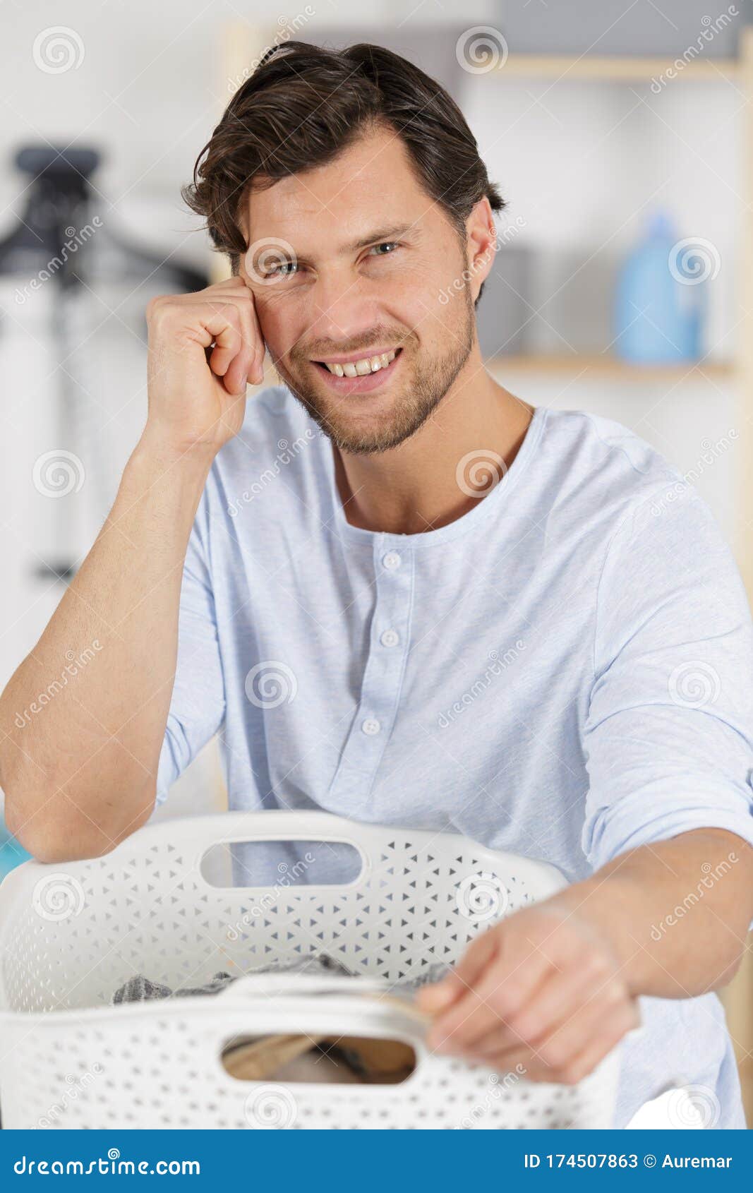 Happy Man Taking Clothes from Drying Rack Stock Image - Image of ...