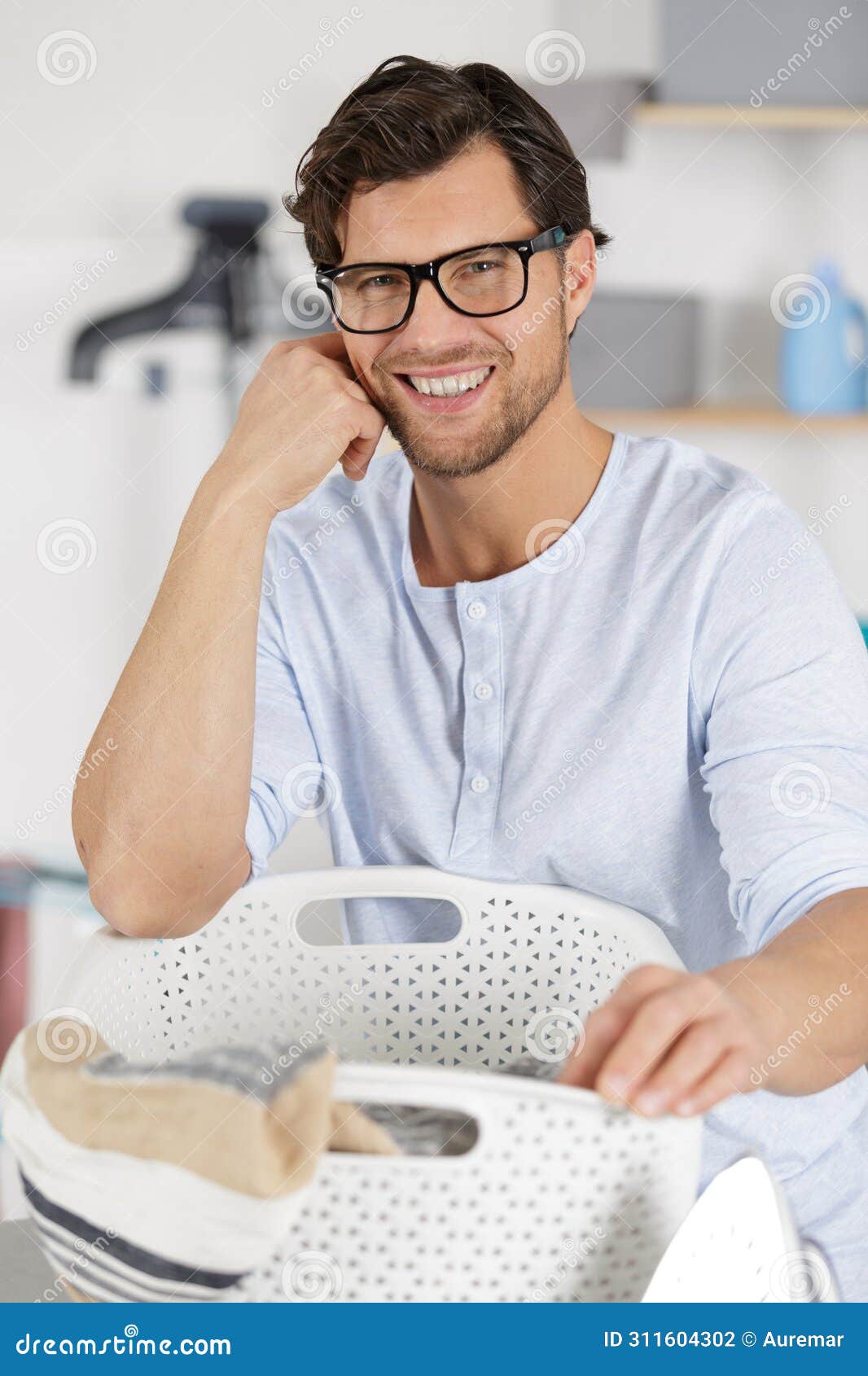 Happy Man Taking Clothes from Drying Rack Stock Photo - Image of ...