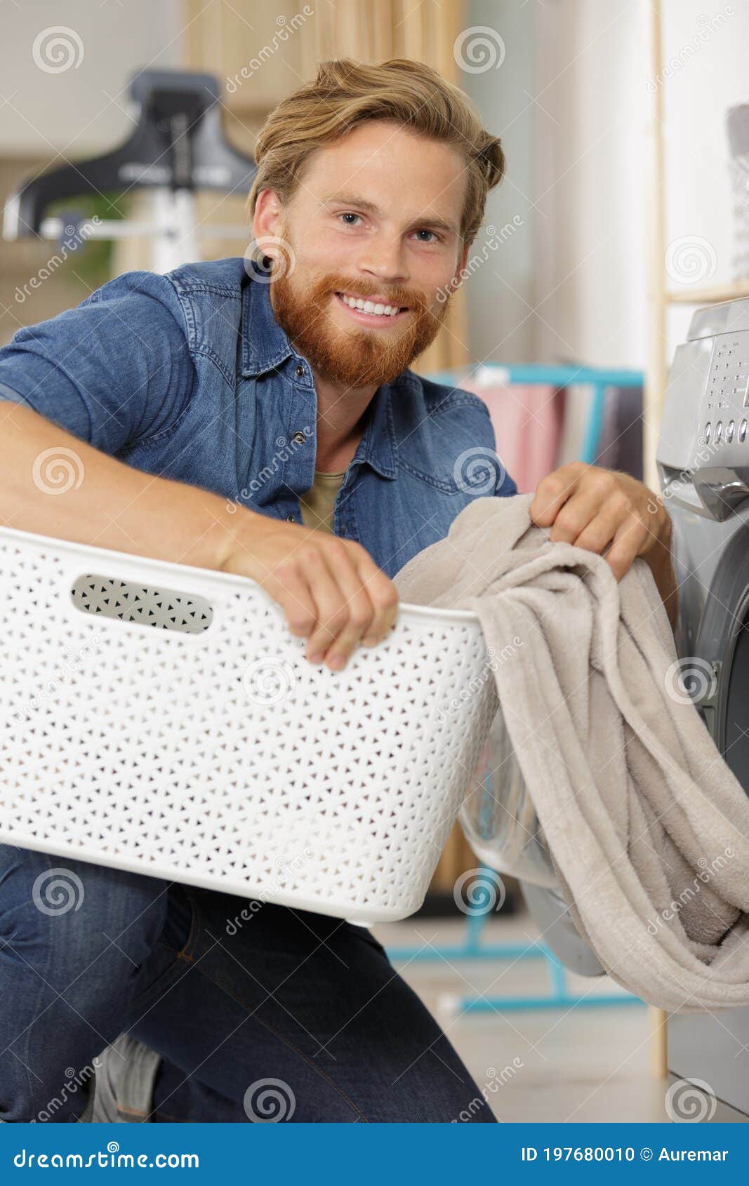 Happy Man Taking Clothes from Washing Machine Stock Photo - Image of ...