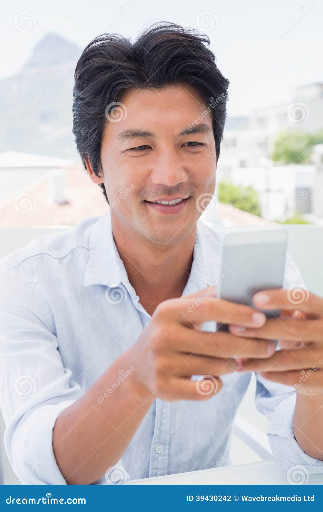Happy man texting on phone stock photo. Image of domicile - 39430242
