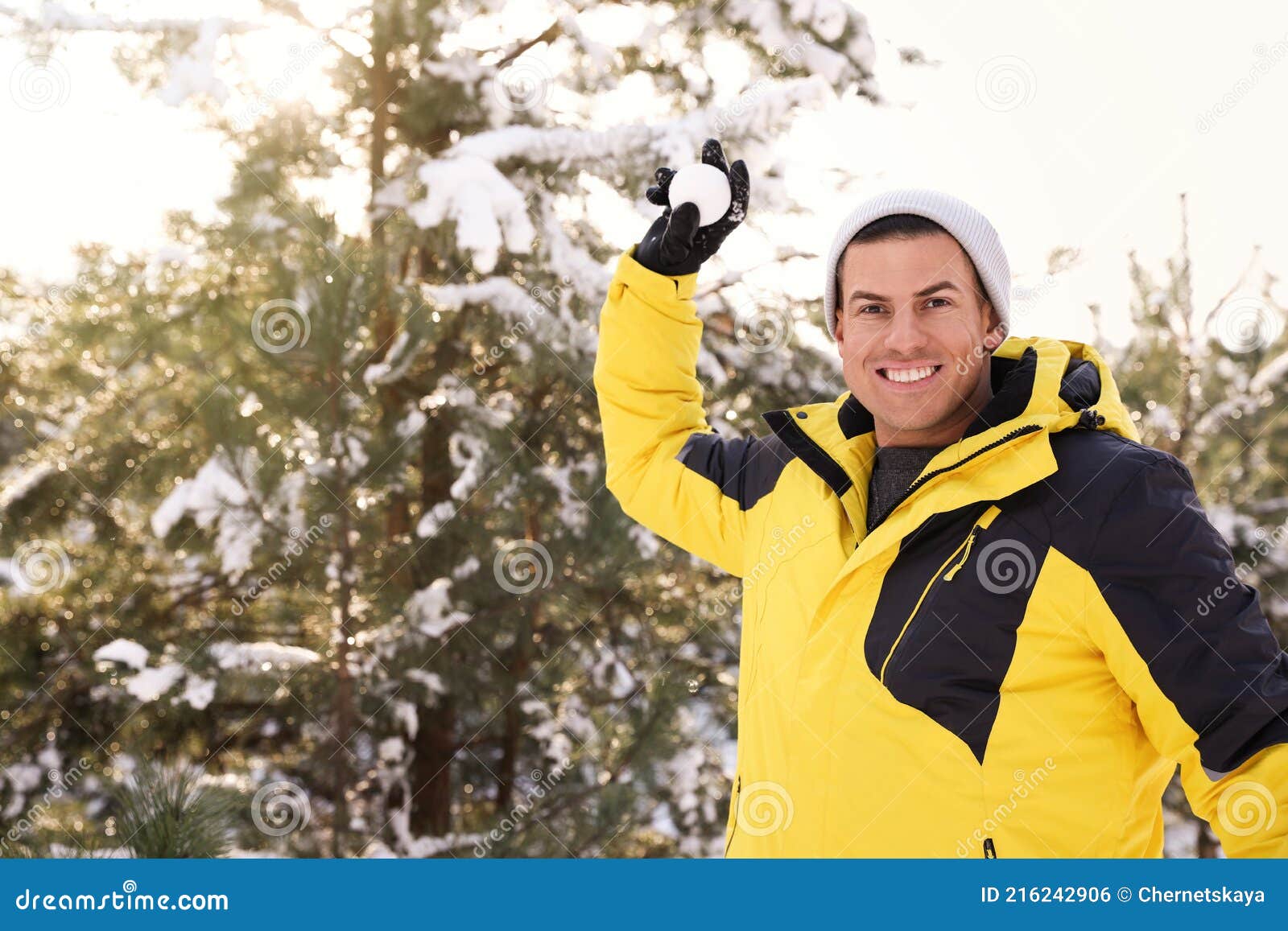 Happy Man Throwing Snowball Outdoors on Winter Day Stock Photo - Image ...