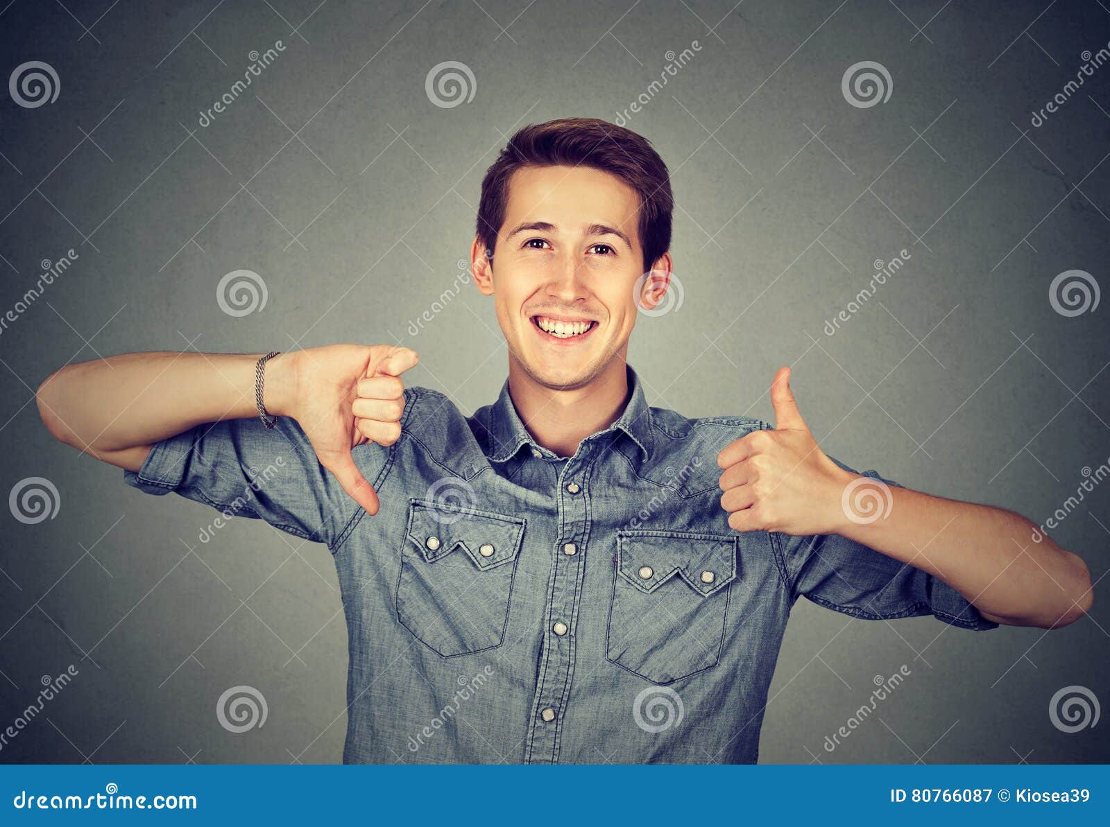 Happy Man with Thumbs Down Thumbs Up Gesture Stock Image - Image of ...