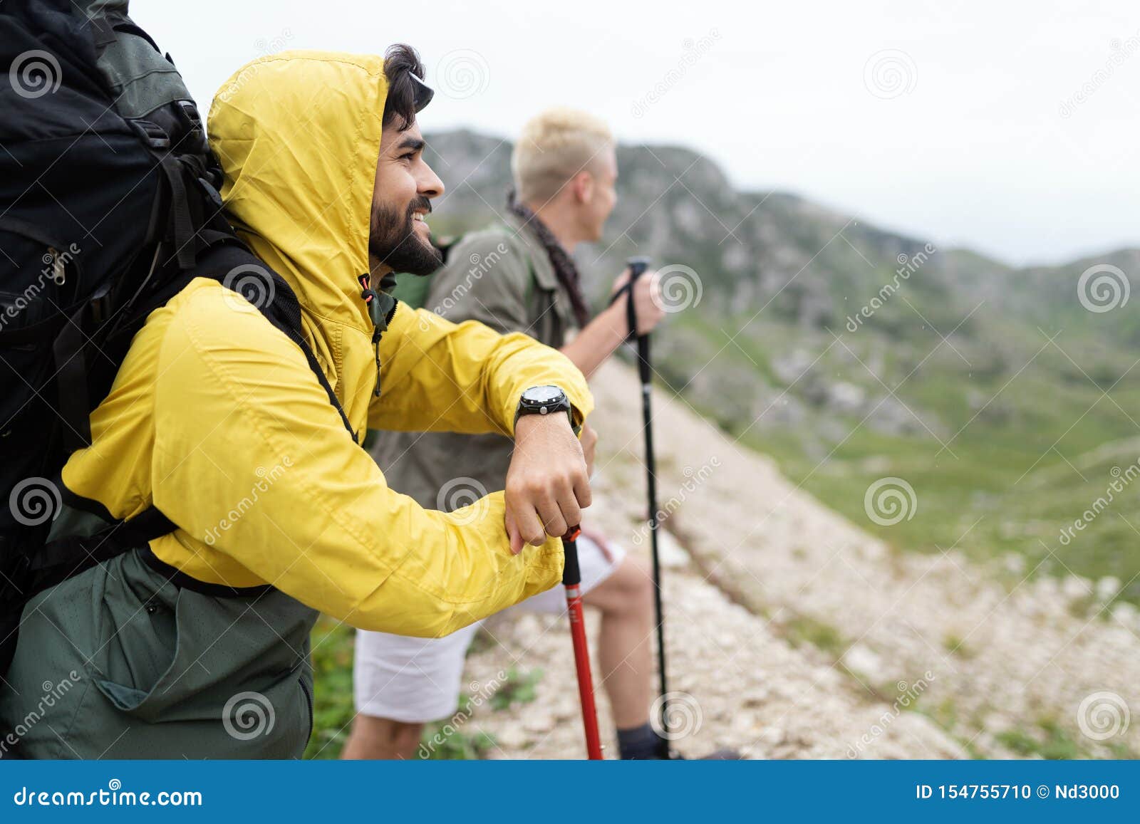 Young Man Traveling with Backpack Hiking in Mountains Stock Photo ...
