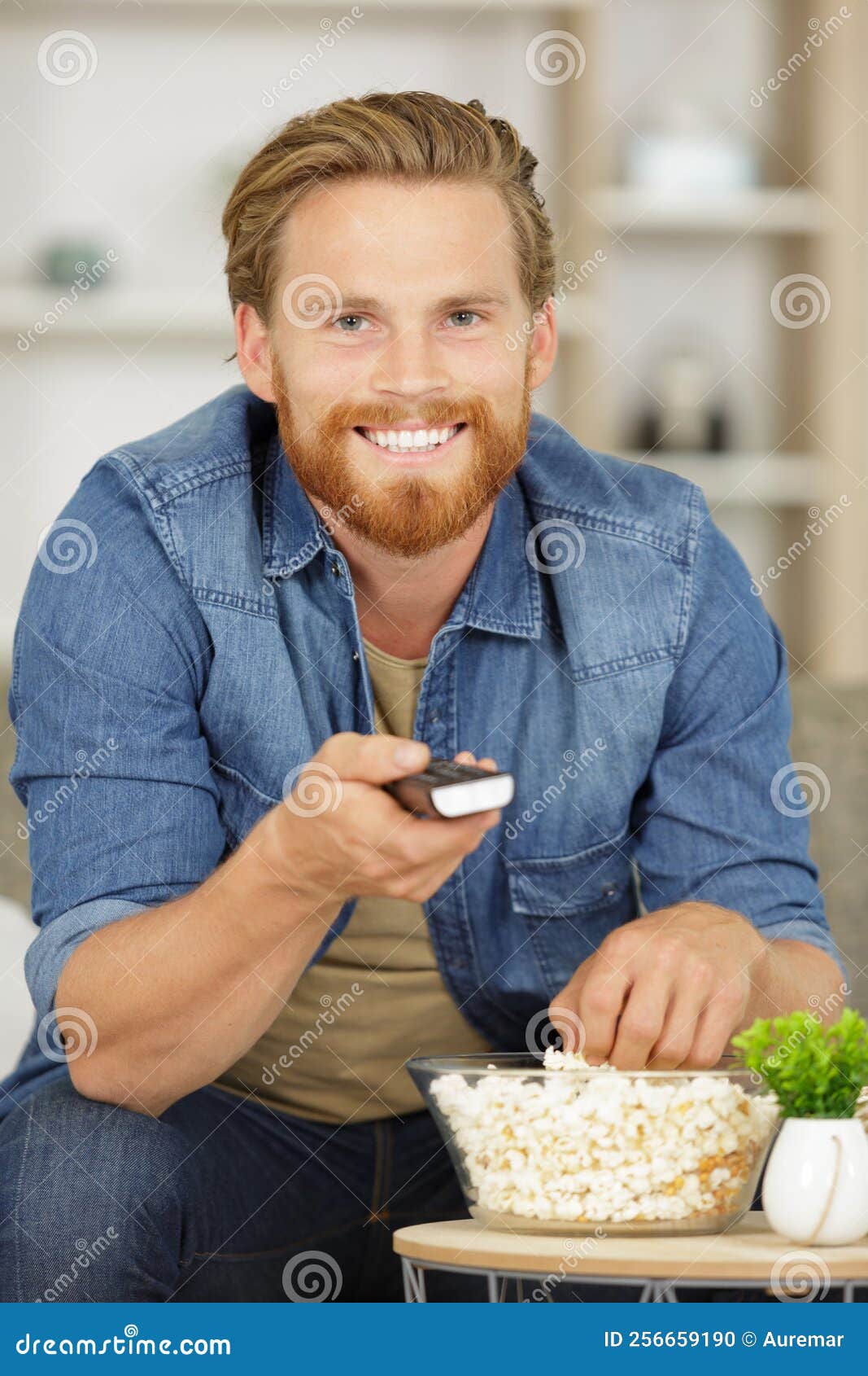 Happy Man with Tv Remote Control Enjoying Time Alone Stock Photo ...
