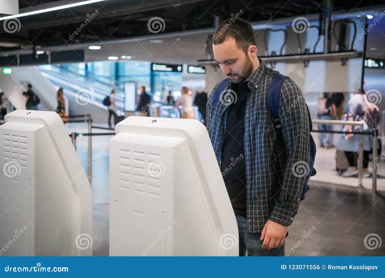 Happy Man Using the Check-in Machine at the Airport Getting the ...