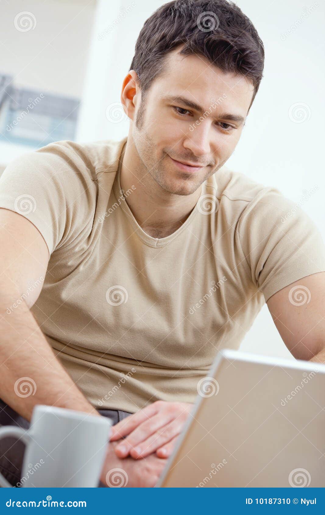Happy man using computer stock photo. Image of couch - 10187310
