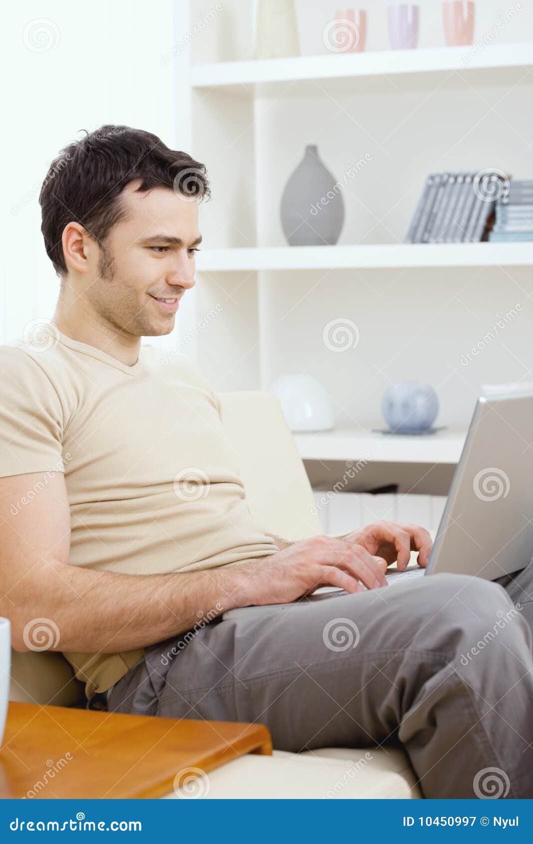 Happy man using computer stock image. Image of clothing - 10450997