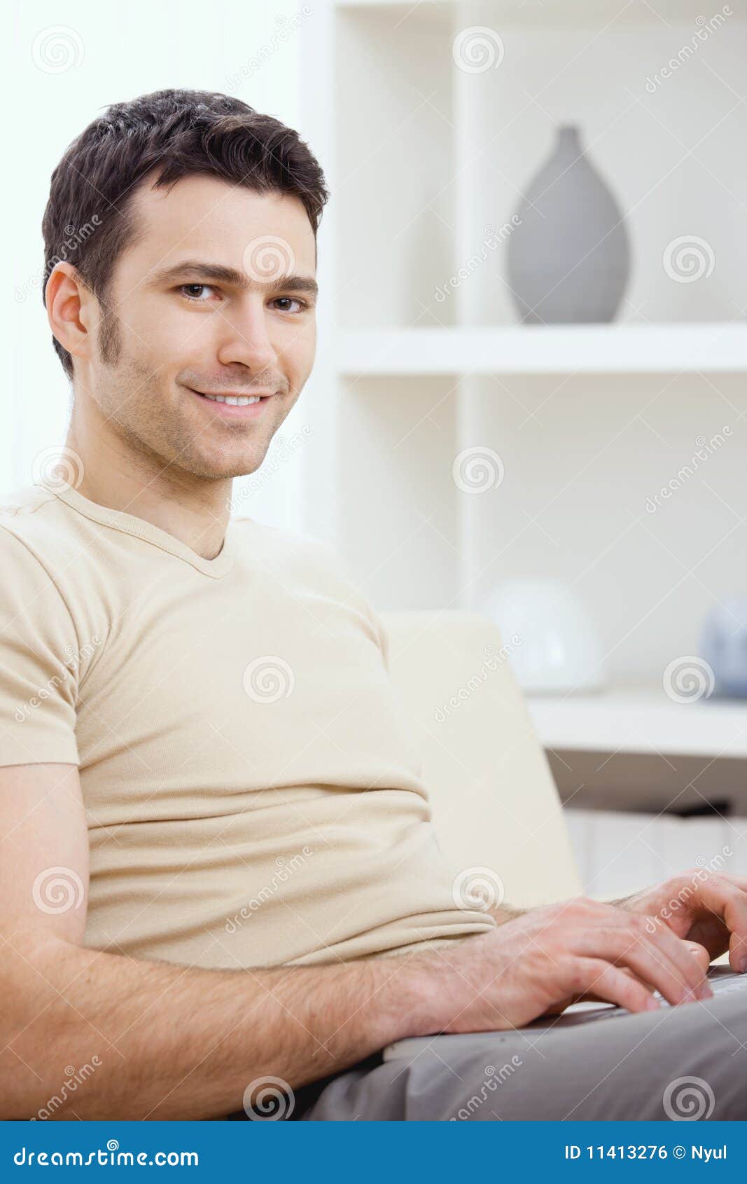 Happy man using computer stock photo. Image of apartment - 11413276