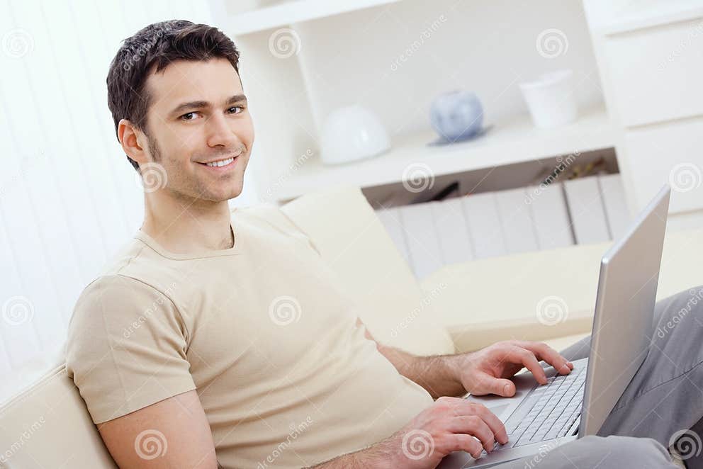 Happy man using computer stock photo. Image of comfort - 11413296