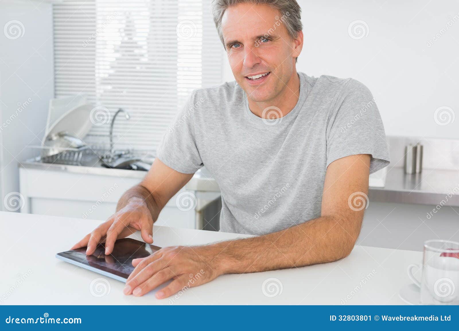 Happy Man Using Digital Tablet in Kitchen Stock Image - Image of ...