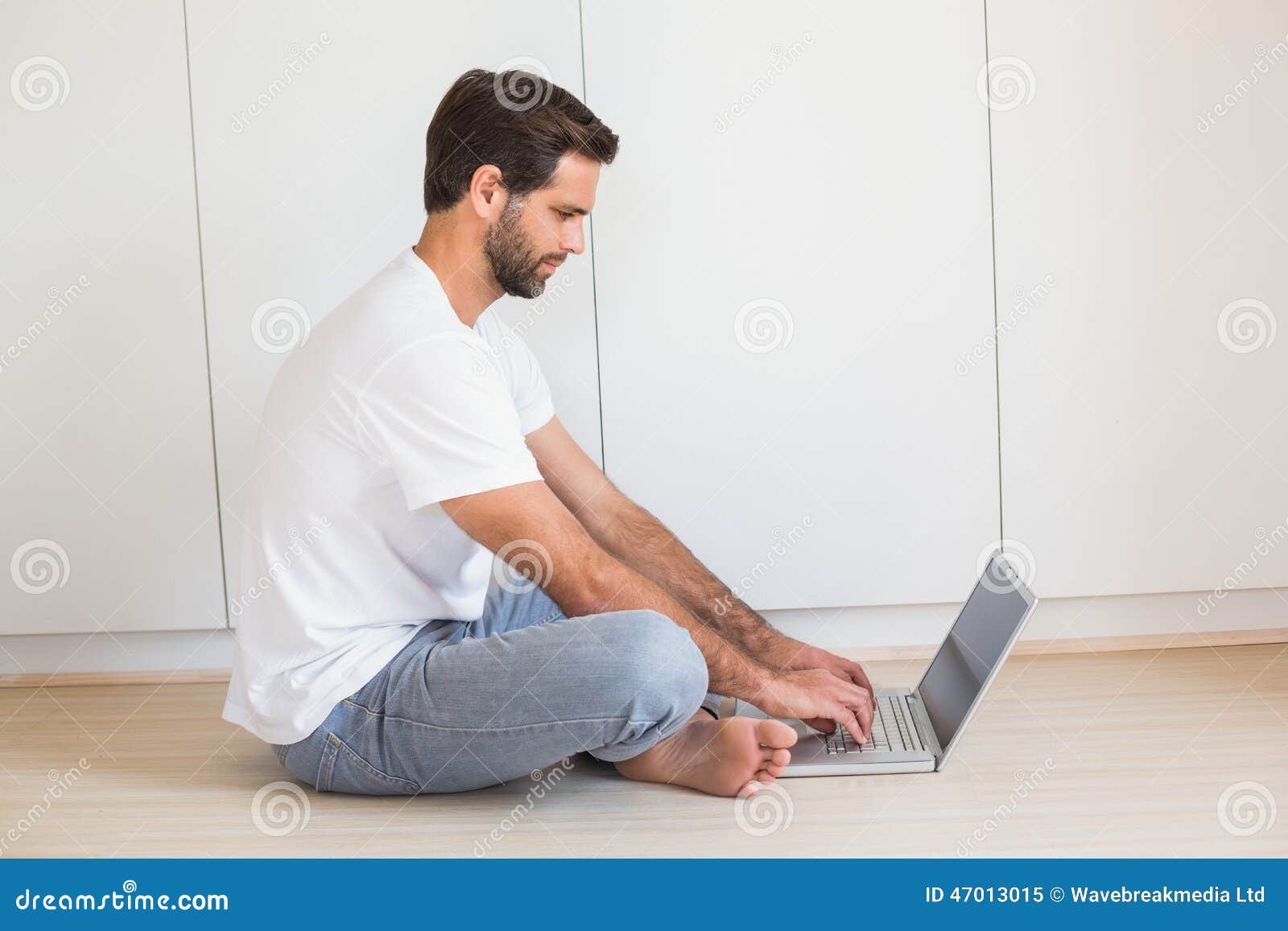 Happy Man Using Laptop on Floor Stock Image - Image of handsome, male ...