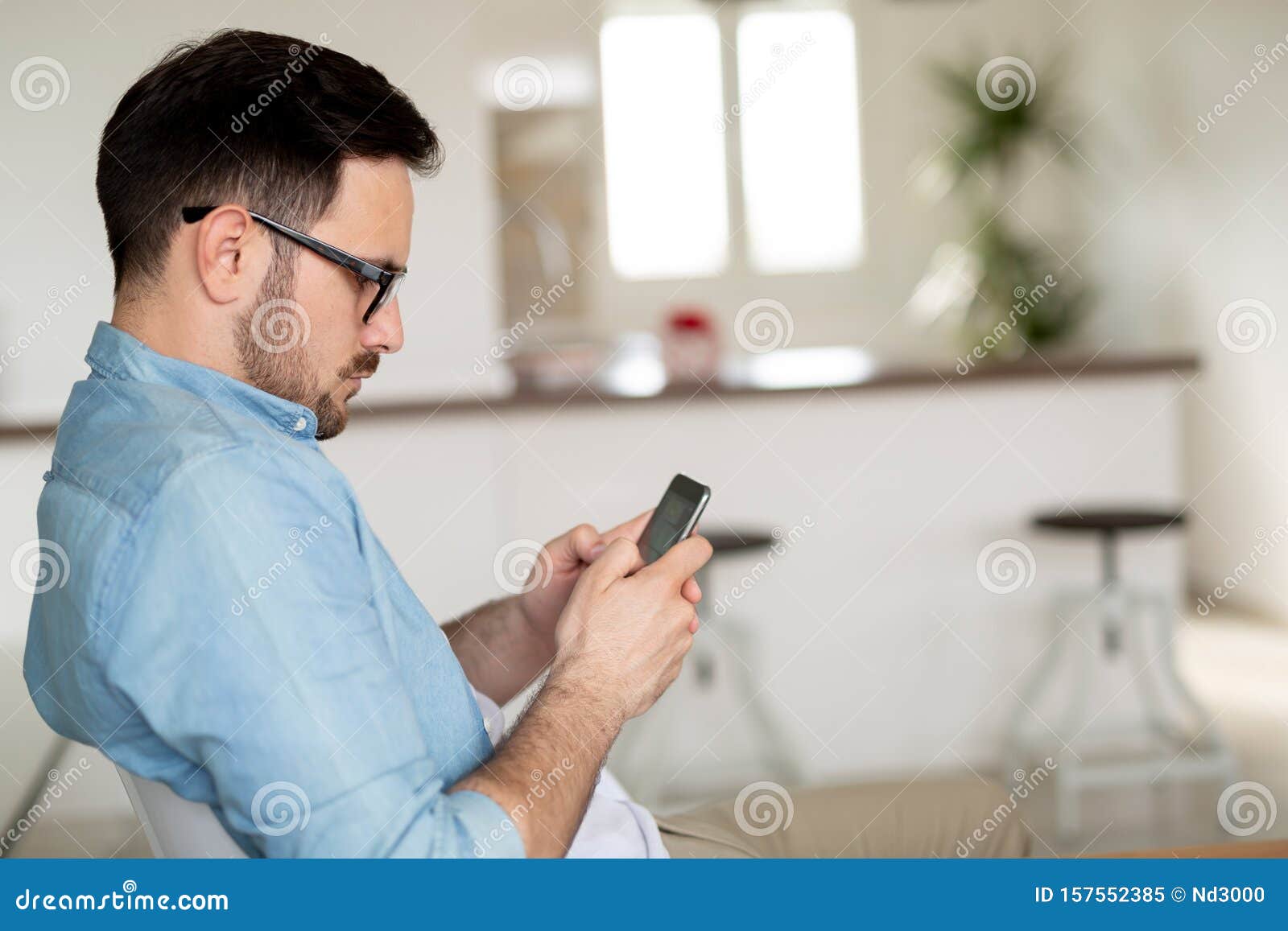 Happy Man Using Mobile Phone at Home Stock Image - Image of office ...