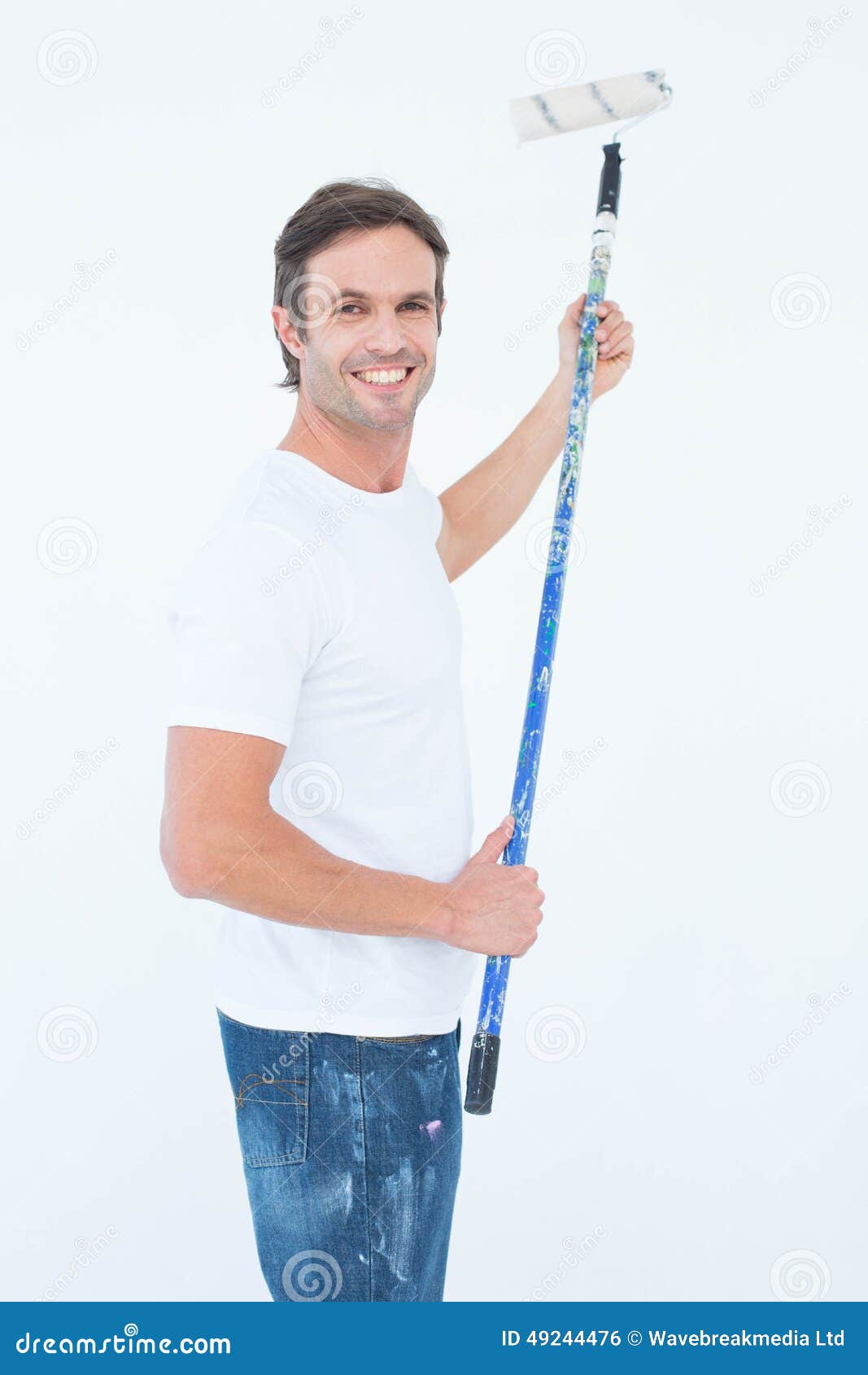 Happy Man Using Paint Roller Stock Photo - Image of background, length ...