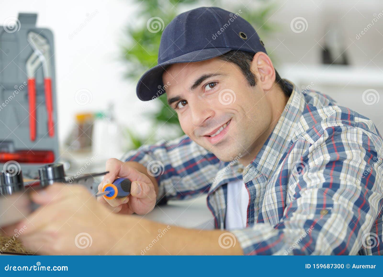 Happy Man Using Screwdriver Stock Photo - Image of recruitment ...