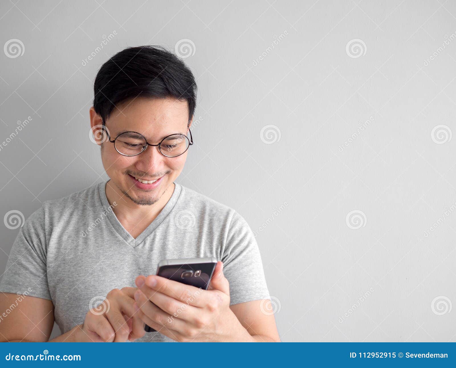 Happy Man is Using Smartphone. Concept of Using Social Media on Stock ... Happy Man is Using Smartphone. Concept of Using Social Media on Stock ...