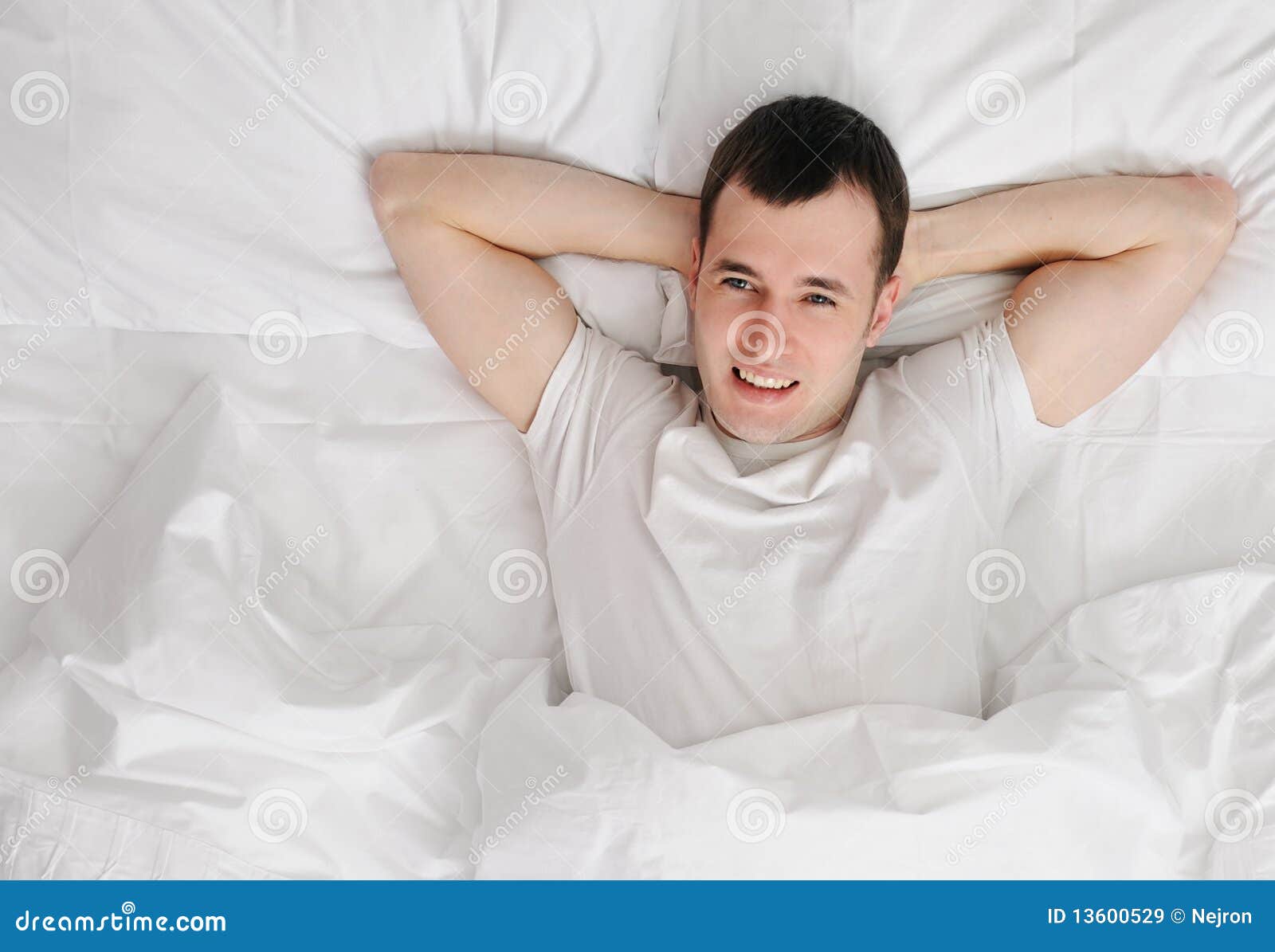Happy man wakening up stock image. Image of relaxed, bedroom - 13600529