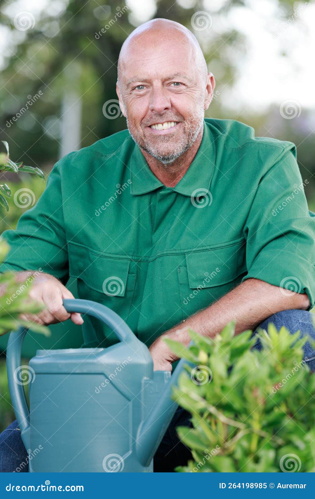 Happy man watering plants stock image. Image of outdoors - 264198985