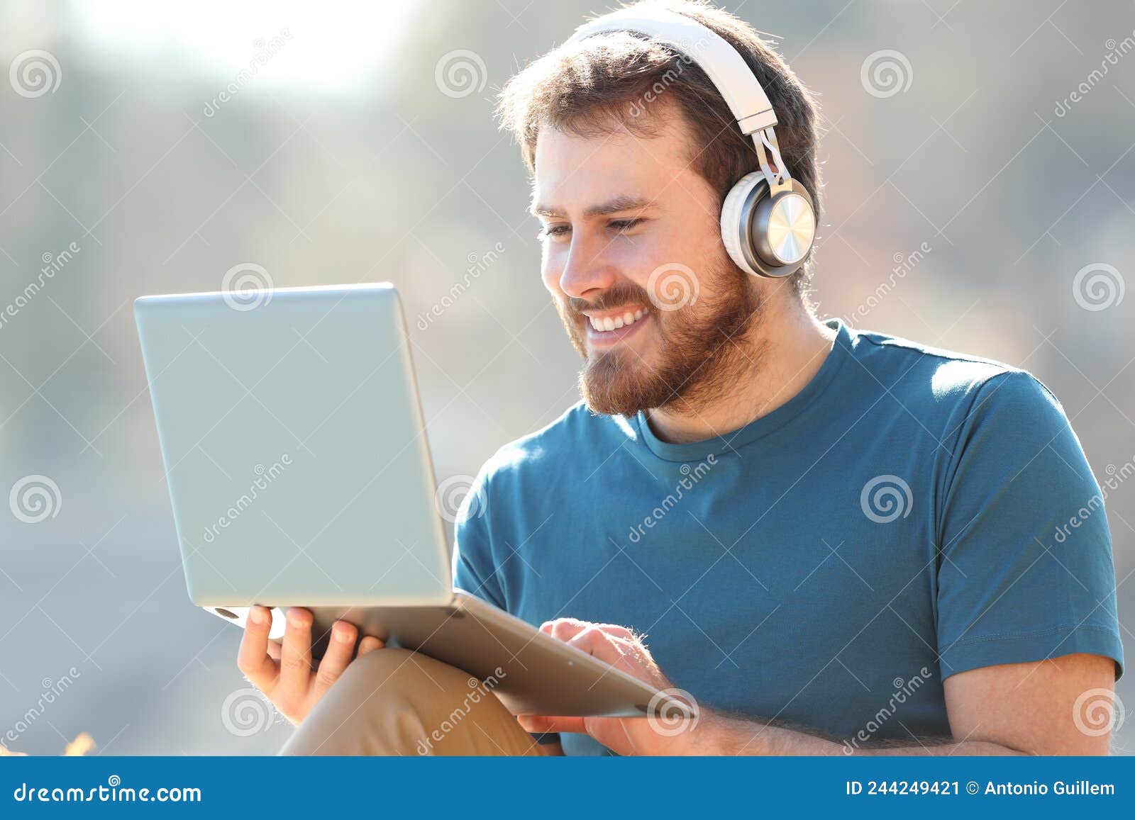 Happy Man Wearing Headphones Using Laptop Stock Image - Image of ...