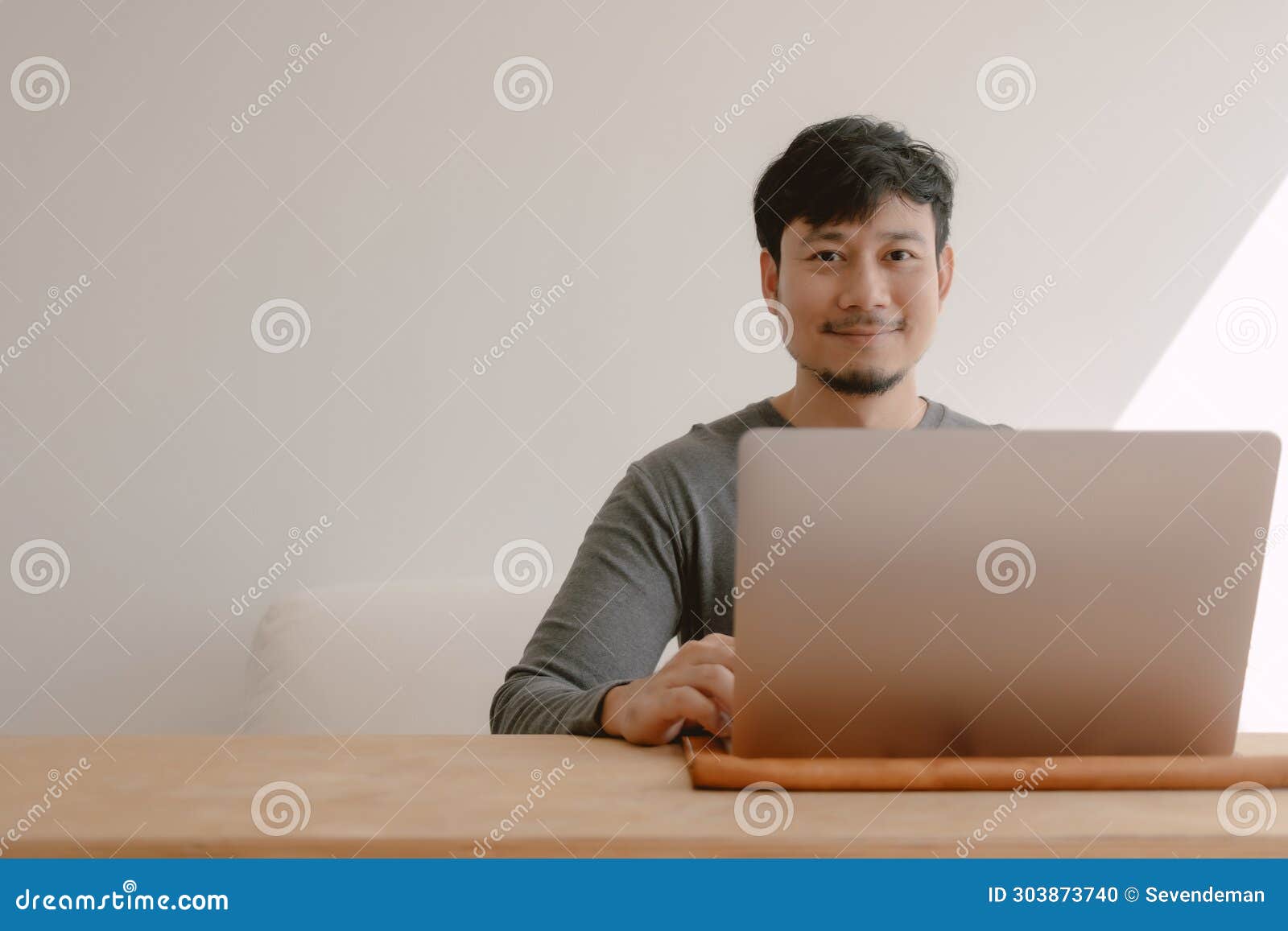 Happy Man Working with Computer Over Empty Space White Wall. Stock ...