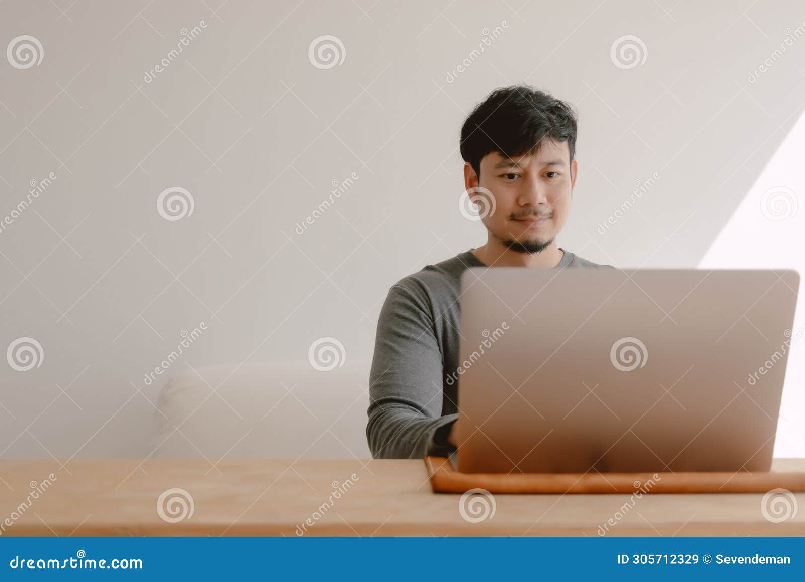 Happy Man Working with Computer Over Empty Space White Wall. Stock ...