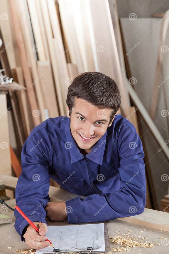 Happy Man Writing in His Workshop Stock Photo - Image of handsome ...