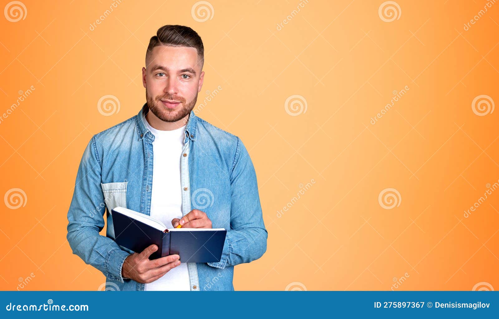 Happy Man Writing in Notebook and Looking at the Camera, Copy Space ...