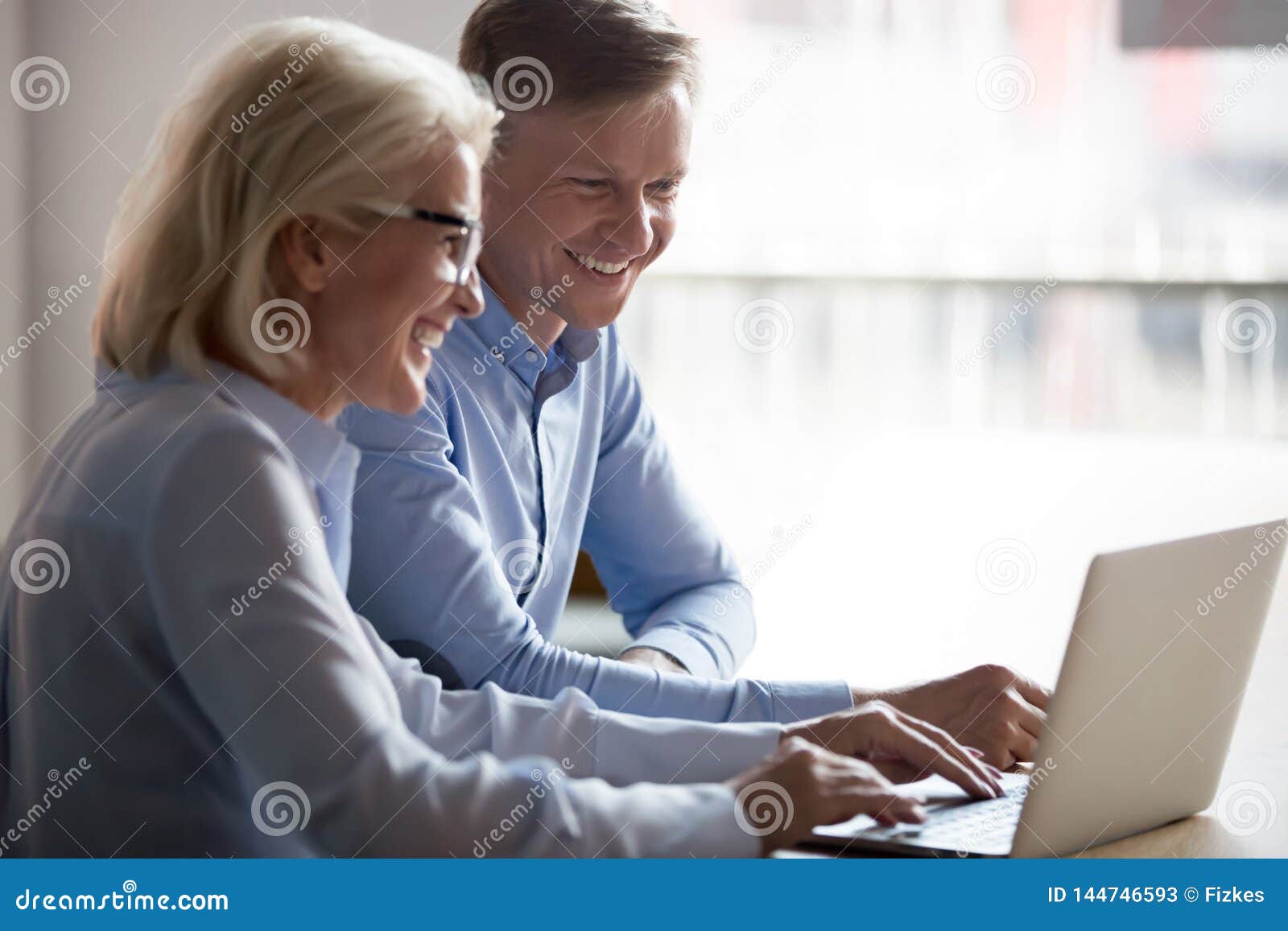 Happy Manager and Client Having Conversation at Meeting with Laptop ...