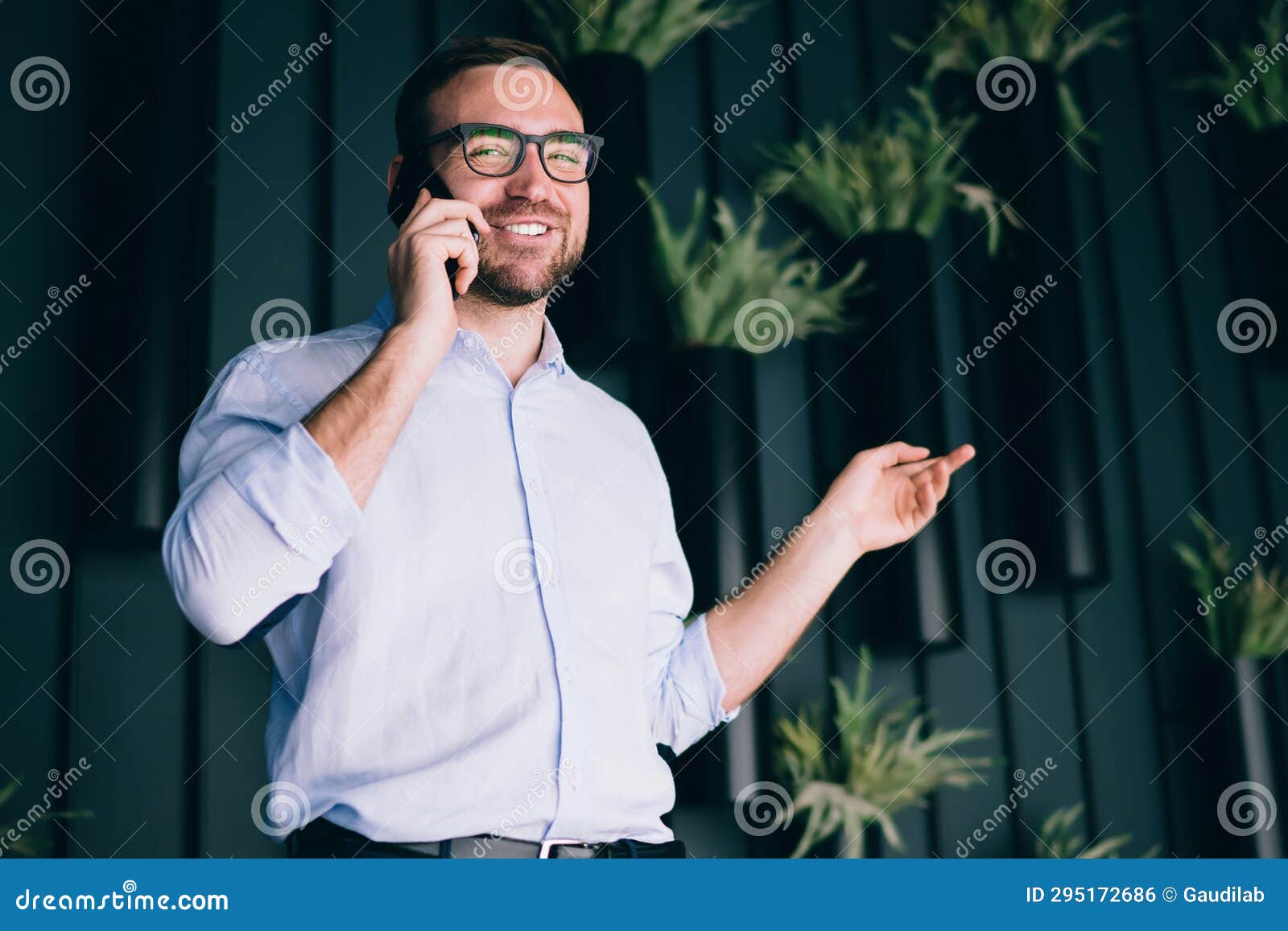 Happy Manager Gesturing and Talking on Smartphone Stock Photo - Image ...