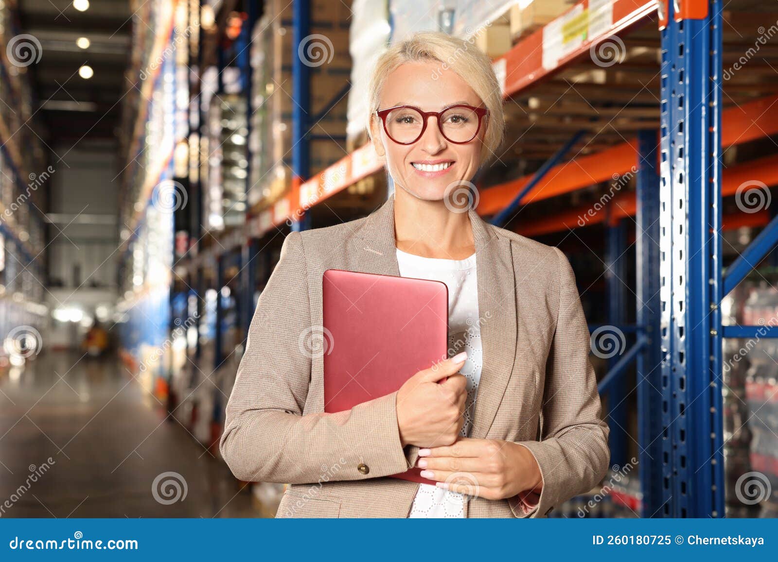 Happy Manager Holding Modern Tablet in Warehouse with Lots of Products ...