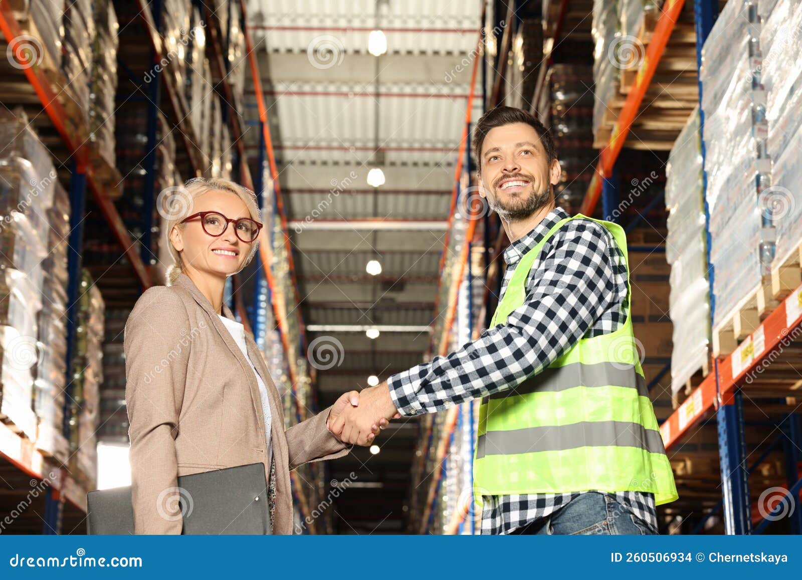 Happy Manager Shaking Hands with Worker in Warehouse Stock Photo ...