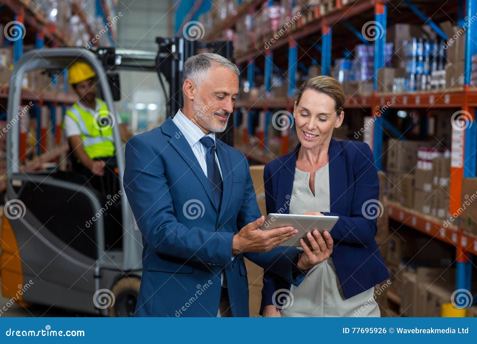 Happy Managers are Standing and Looking a Tablet Stock Photo - Image of ...