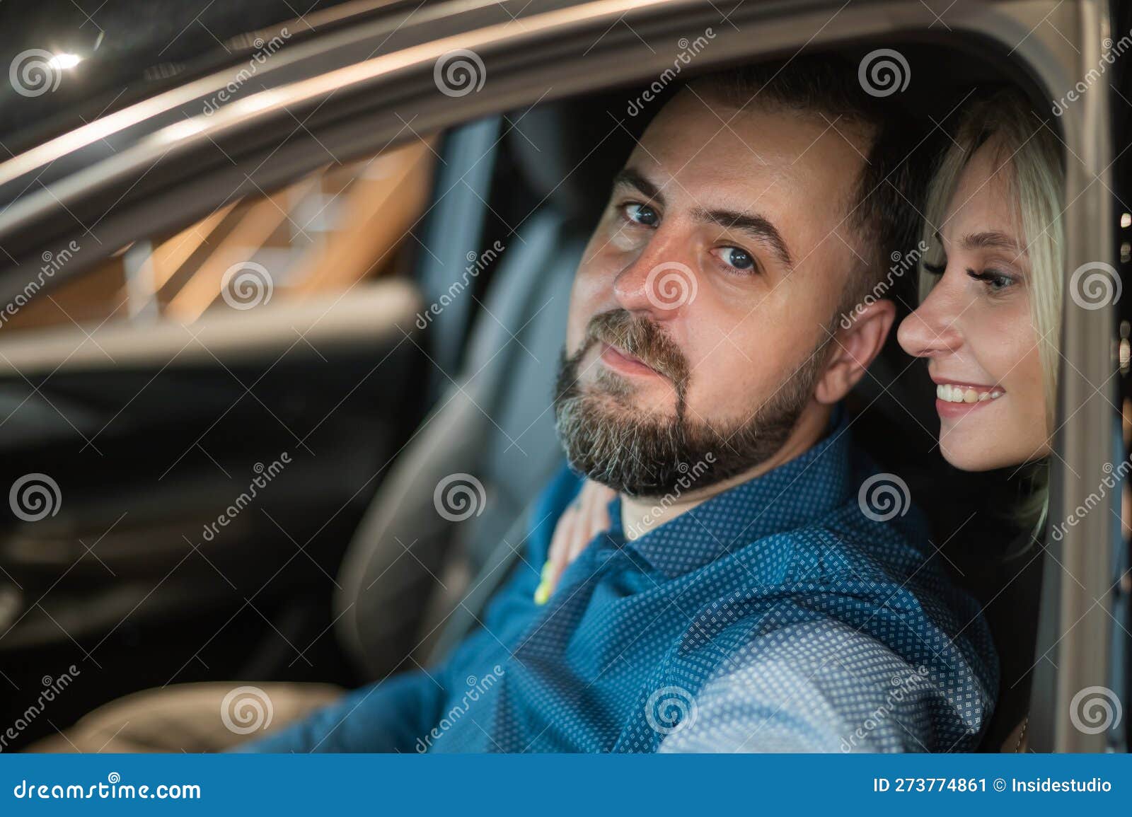 Happy Married Couple Testing New Car in Car Showroom. Stock Image ...