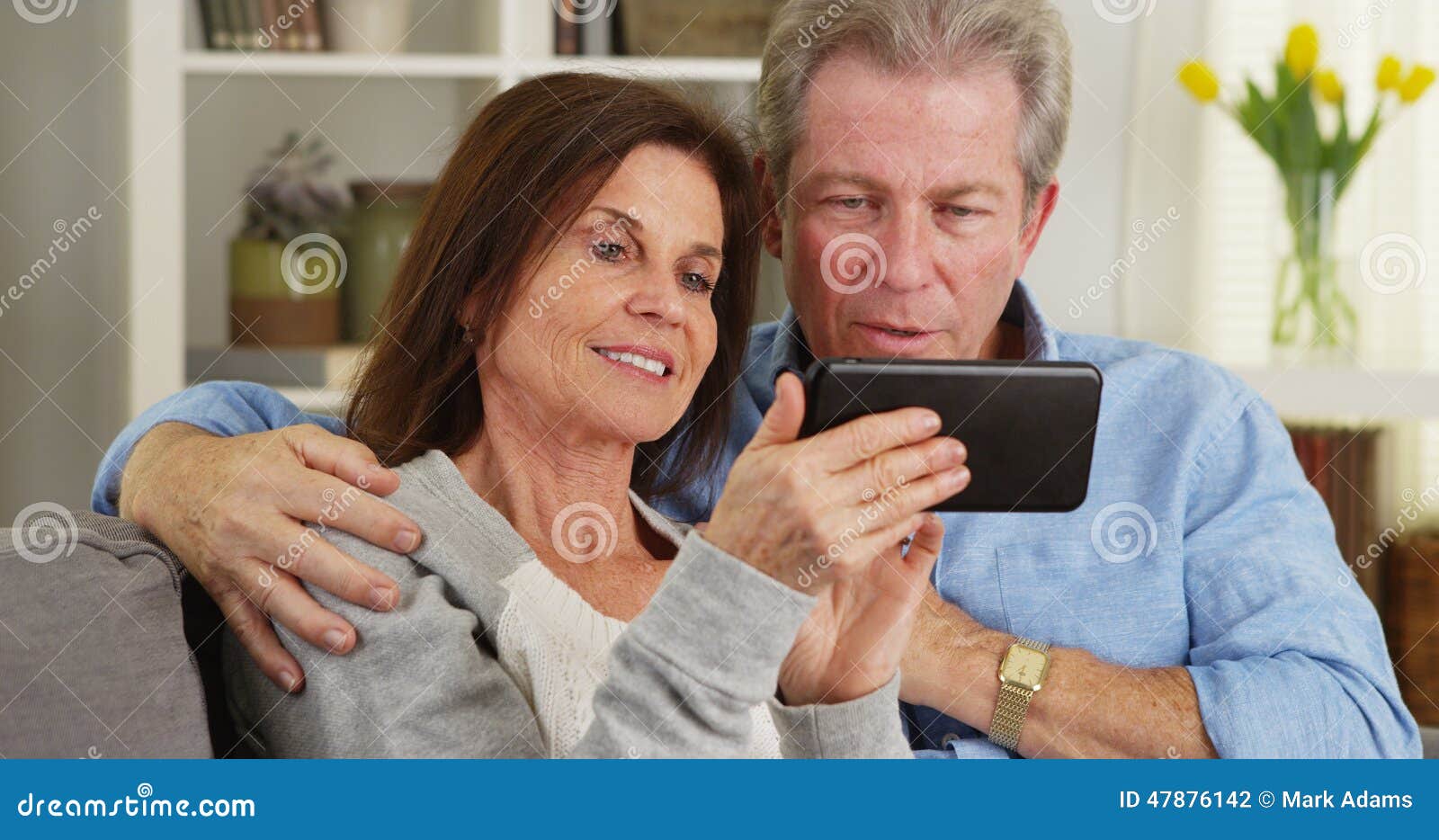 Happy Married Couple Using Smartphone Stock Photo - Image of cellphone ...