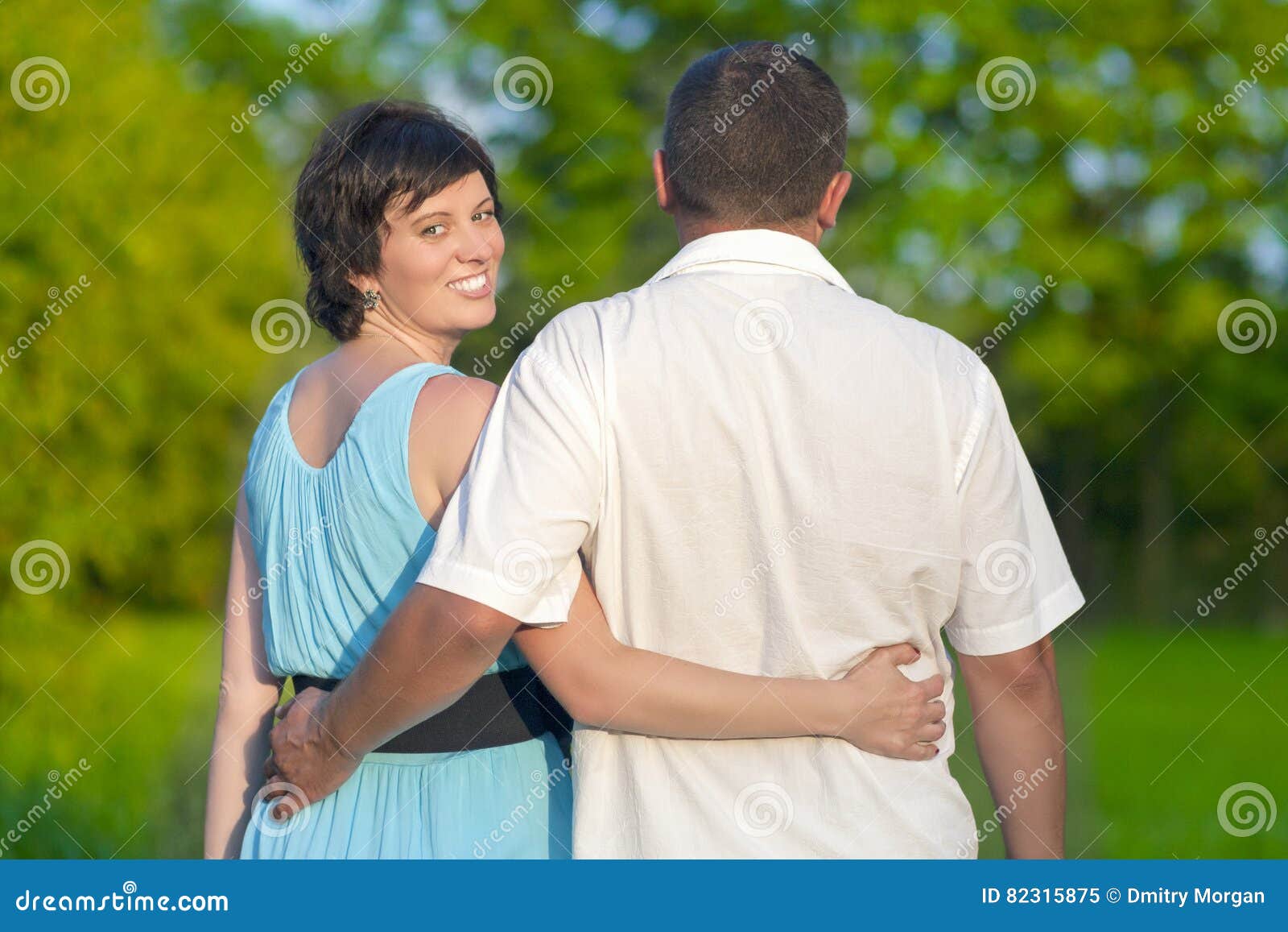 Happy Mature Caucasian Couple Having A Walk Together Outdoors Embraced