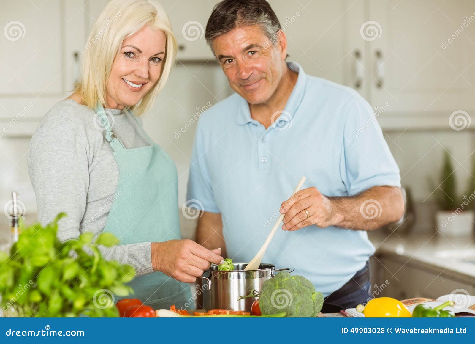 Happy Mature Couple Making Dinner Together Stock Photo - Image of ...