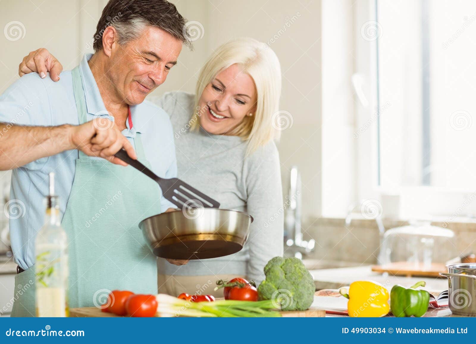 Happy Mature Couple Making Dinner Together Stock Photo - Image of ...